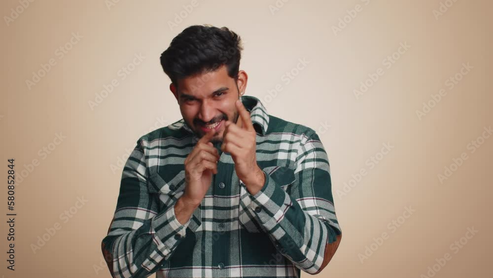 Villain idea. Sneaky young indian man conspiring scheming, thinking ...