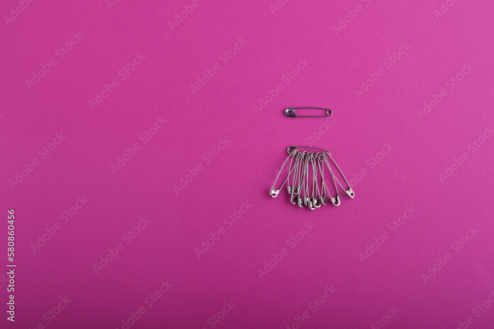 An example of a beautiful safety pin in silver, below is a large bunch ...