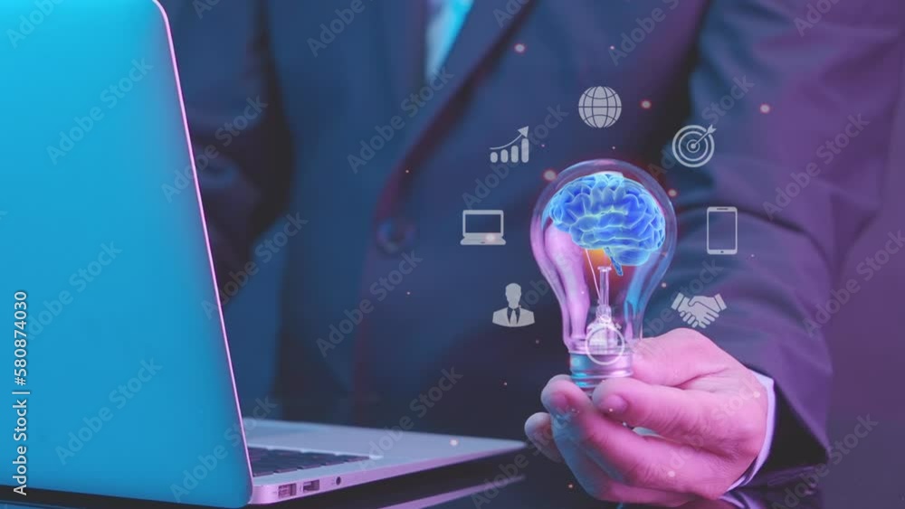 Businessman shows human brain inside glowing light bulb for creative ...