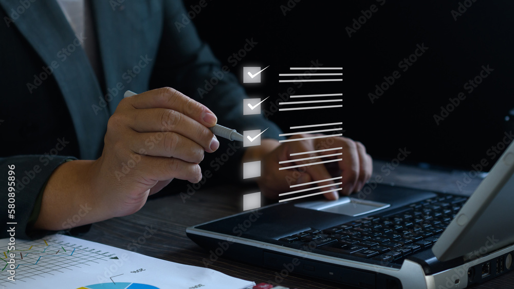 Checklist concept. Hands are holding on. Check mark on wooden block ...