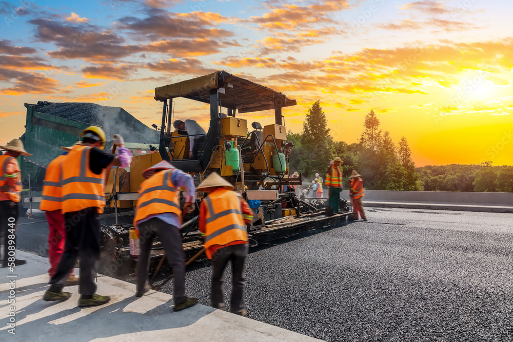 Construction site is laying new asphalt pavement, road construction ...