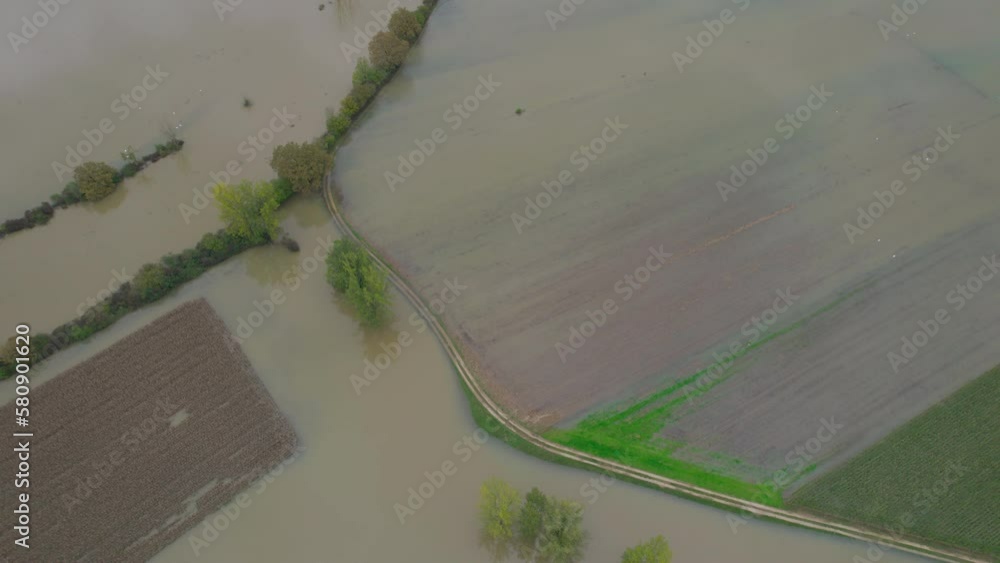 AERIAL: Severe flooding of cultivated land after abundant seasonal rainfall. Agricultural fields ...