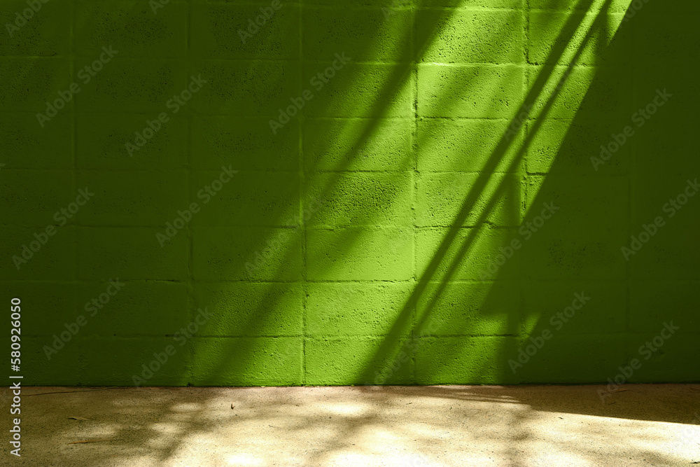 Texture, wall of weathered green color, with flashes of light and ...
