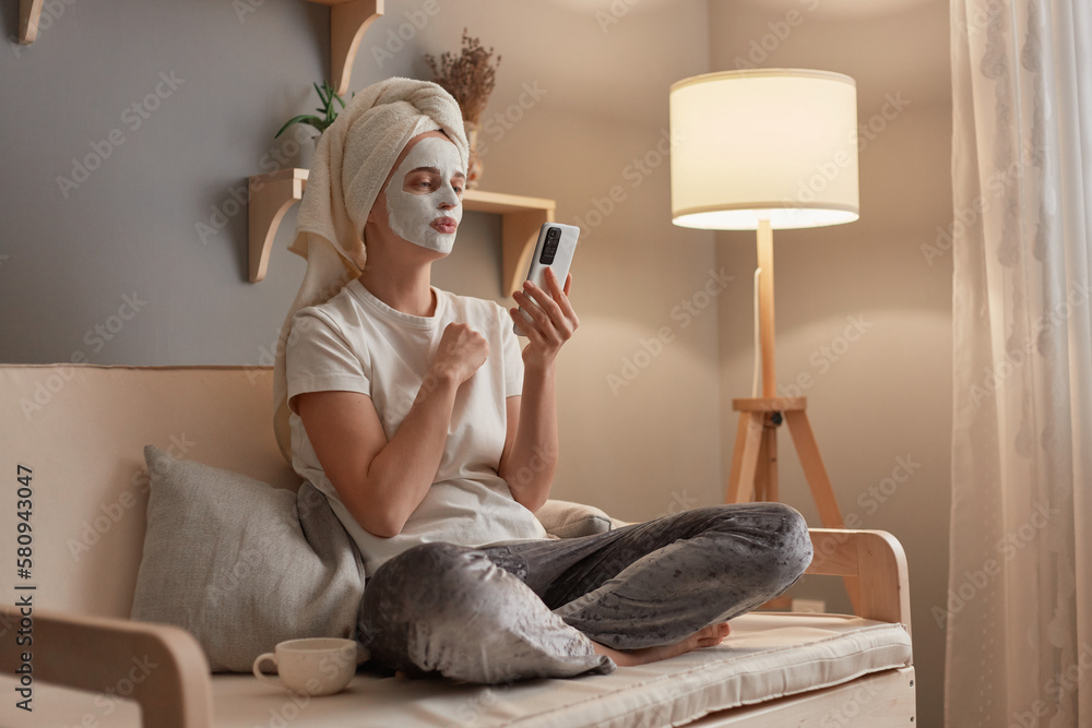 Portrait of charming Caucasian woman with beauty mask on her face ...