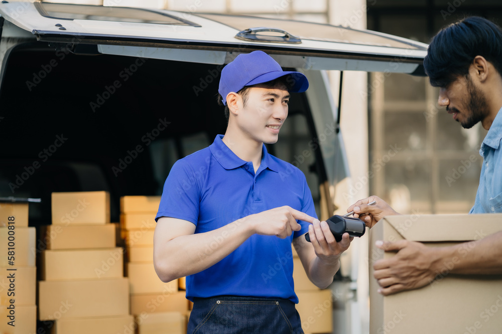 Asian delivery man, Hand using smart phone to scan QR code on tag ...
