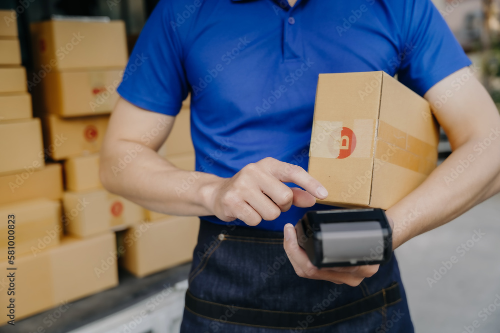 Asian delivery man, Hand using smart phone to scan QR code on tag ... Asian delivery man, Hand using smart phone to scan QR code on tag ...