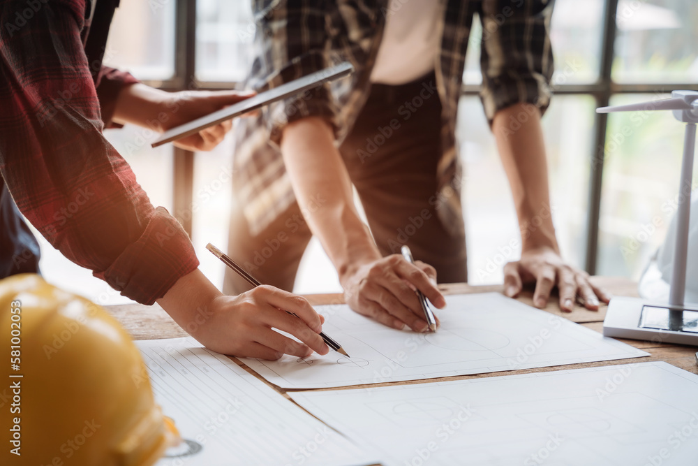 architect working on table use drawing tool on the paper plan for ...