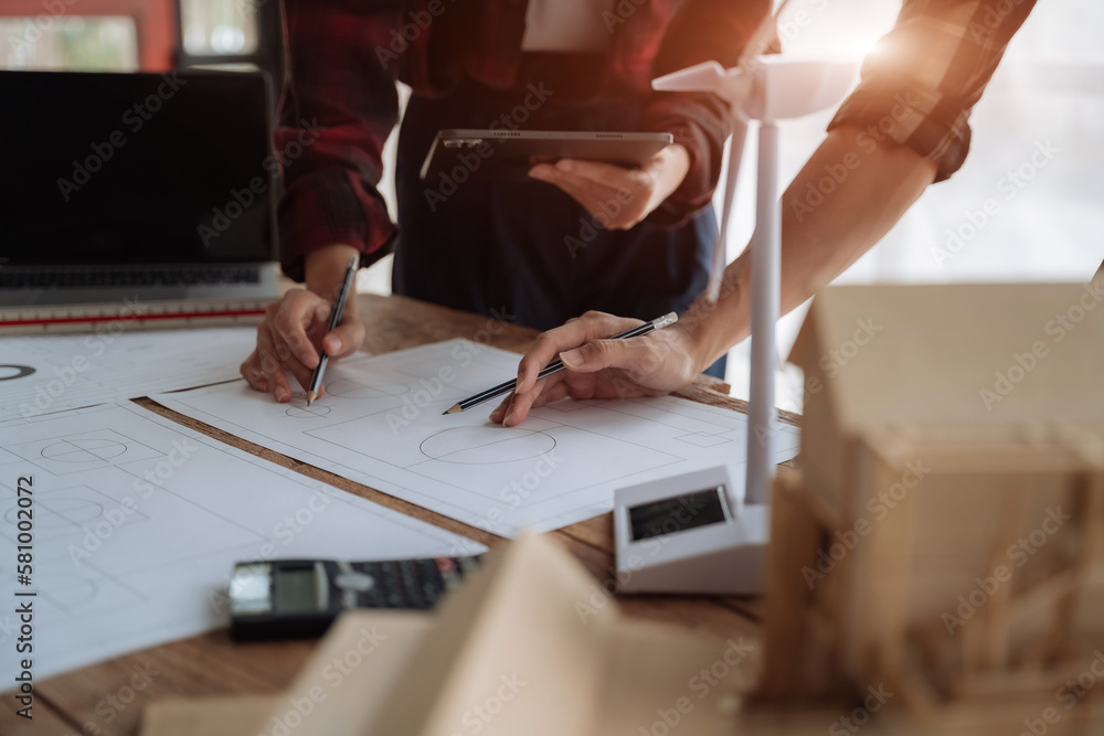 architect working on table use drawing tool on the paper plan for ...