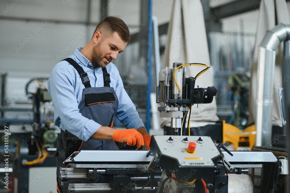 Male factory mechanics or Engineer in safety uniforms are working on ...