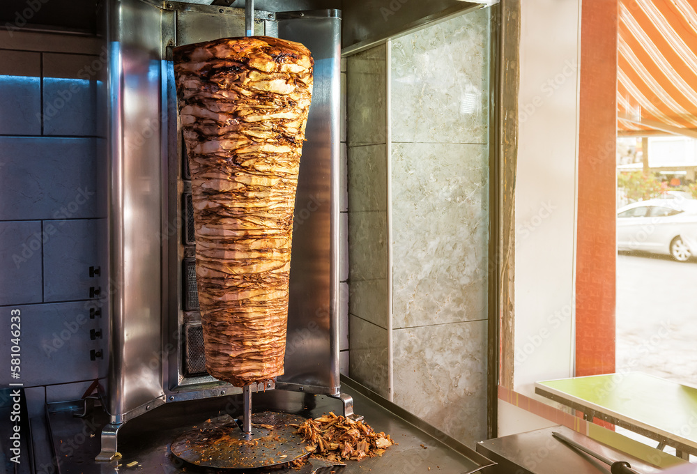 Rotating spit for making traditional turkish street food Doner Kebab on ...