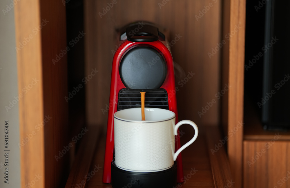 Espresso coffee machine that works with coffee capsule. Making an ...
