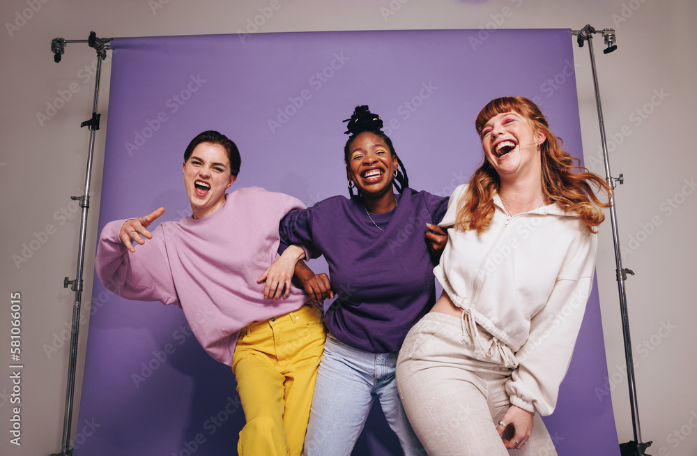Three multicultural friends dancing and having fun in a studio Stock ...