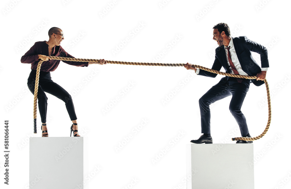 Corporate businesspeople battling in a tug of war on a transparent ...