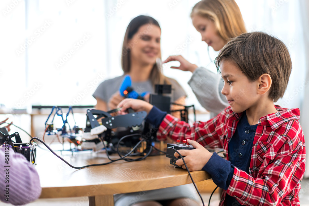 Portrait teacher helping school children student having fun activity ...