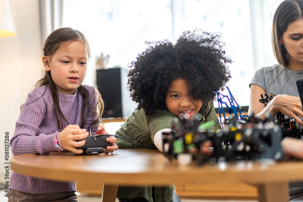 Portrait teacher helping school children student having fun activity ...