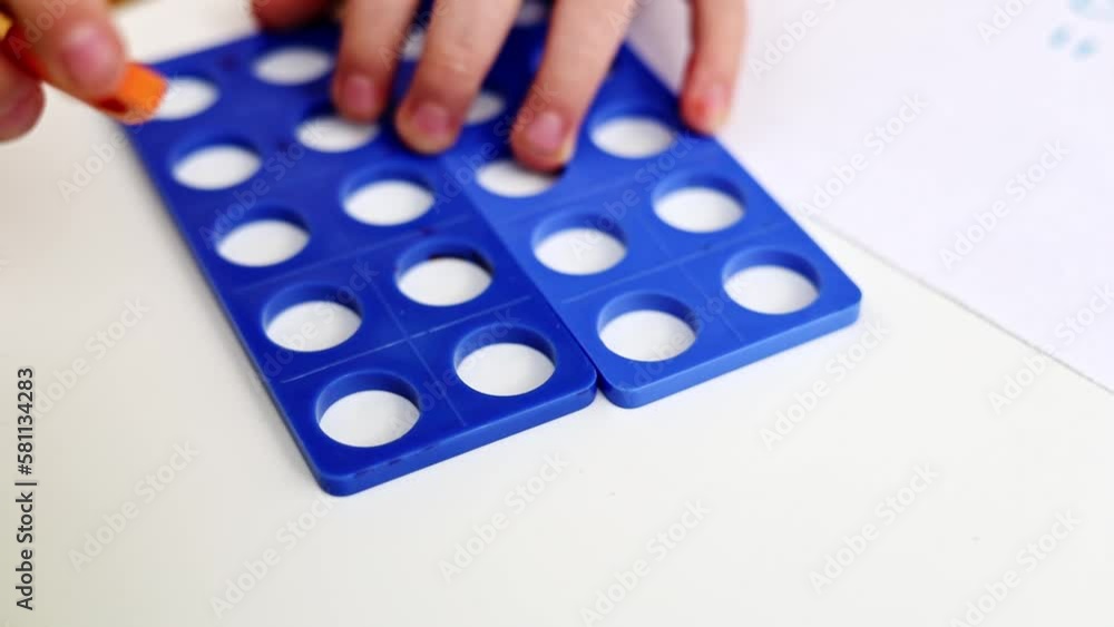 Stockvideo The Numicon shapes close-up when autistic child is having ...