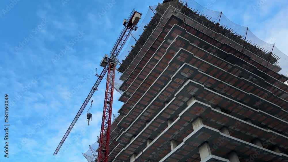 Builder Carrying Cement on a Giant Crane to Lift Onto the Construction ...