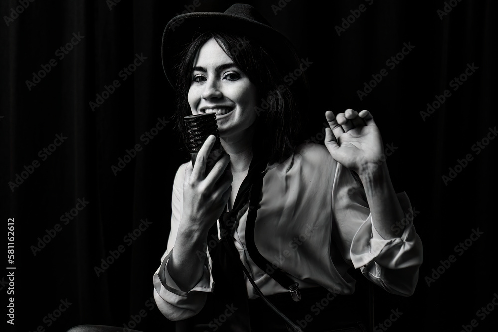 Vintage brunette girl singing with passion and hand gestures into a ...