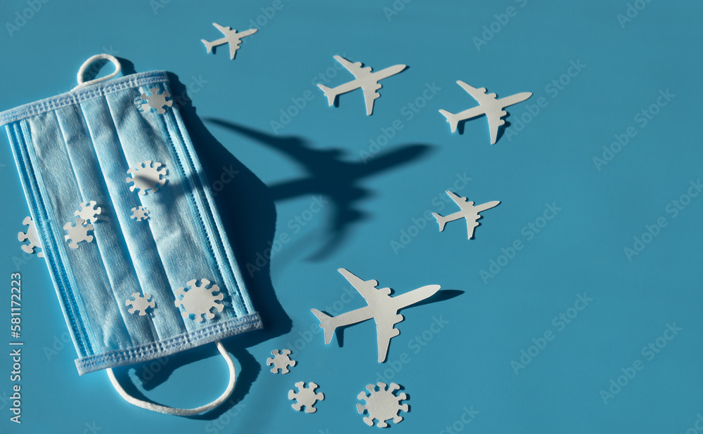 Flat layout a medical face mask, paper airplanes , paper Coronavirus ...