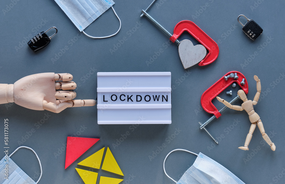 Abstract oppression symbols are laid around text box with word Lockdown ...