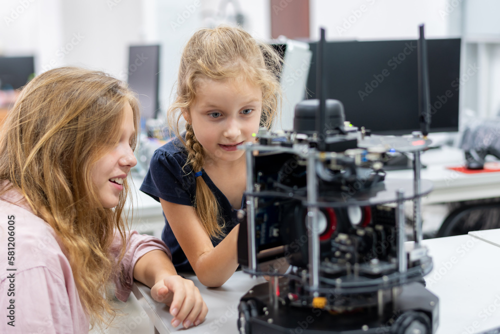 Group Kid teen child enjoy Machine Learning Robot arm is Moving Under ...