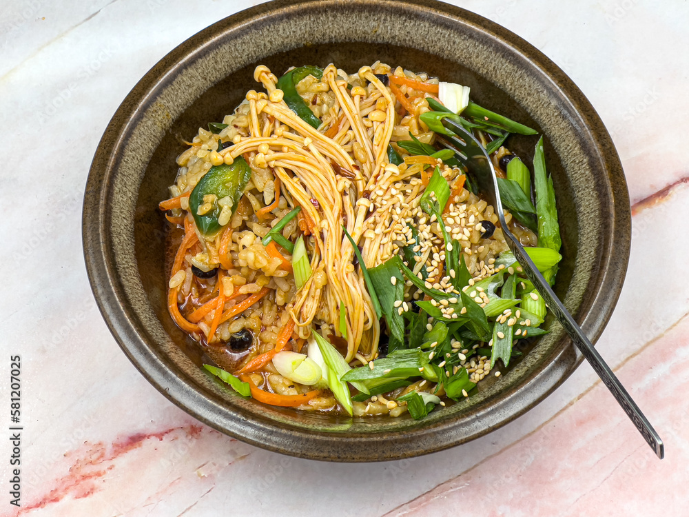 Foto de Korean vegan fried rice with kimchi, enoki mushrooms do Stock ...