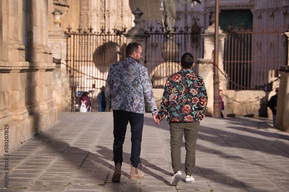 Real marriage of gay couple, walking in the city, holding hands ...