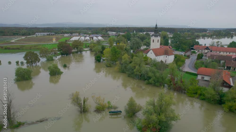 Vidéo Stock AERIAL: Flooded area around a small rural town after a swollen river overflowed ...