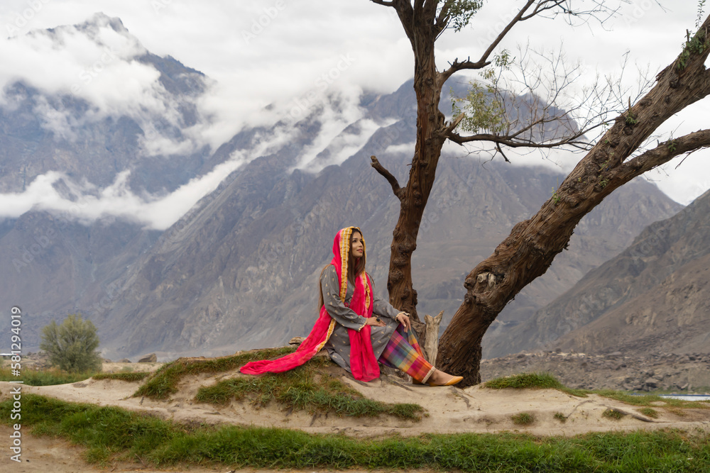 A Pakistani woman tourist travel in Karakoram high mountain hills ...