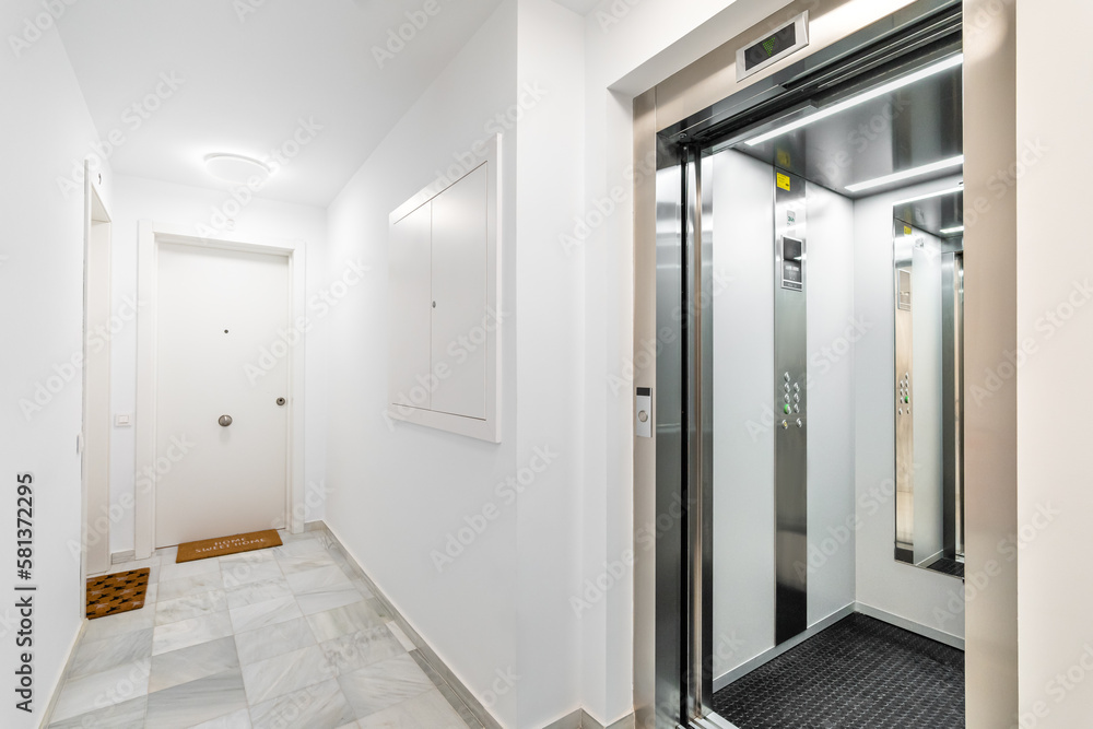 Modern reliable outdoor elevator with a view of the hall and doors to ...