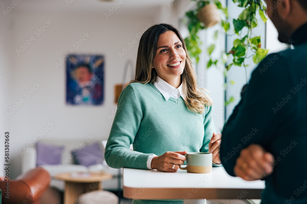Happy businesswoman with blonde hair having an informal conversation ...