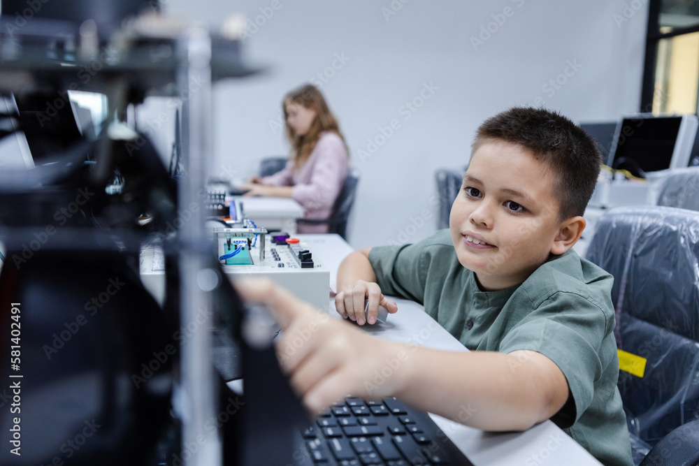 Boy in electronic class room. Kid boy education electronic AI class and ...