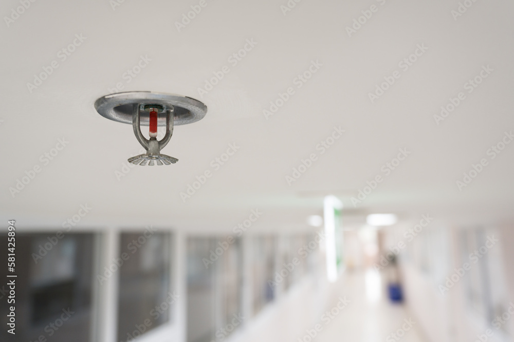 Fire fighting equipment, sprinkler on white ceiling background ...