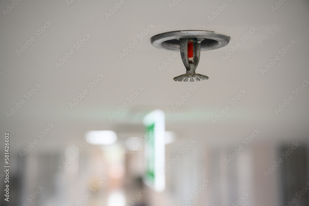 Fire fighting equipment, sprinkler on white ceiling background ...