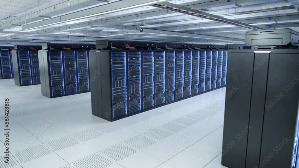 Inside Large Bright Working Data Center with Rows of Server Racks. Supercomputer and Advanced ...
