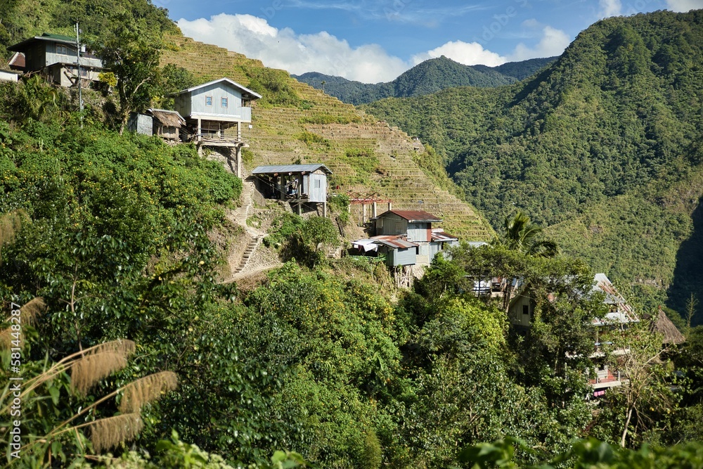 The rice terraces of Banaue in the Philippines with houses on them ...