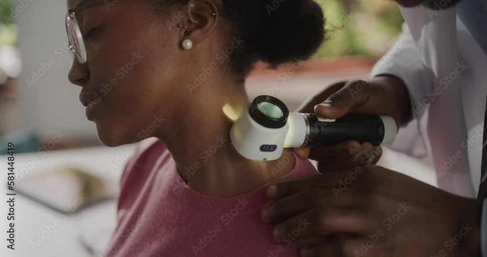 Close Up Footage of an African Skin Care Professional Using a ...