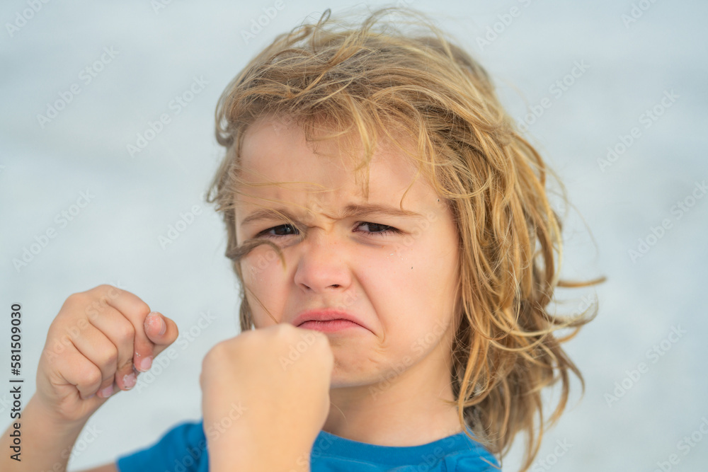 Enraged kid boy with angry expression. Angry hateful little anger boy ...