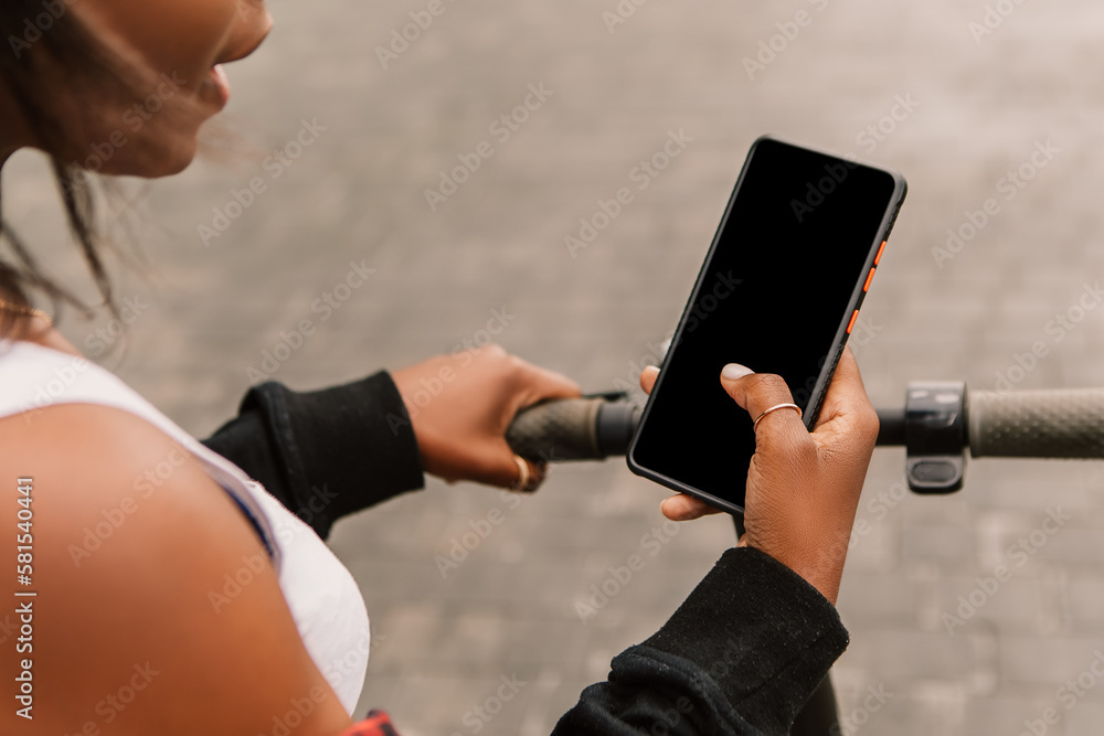 Mock up black screen african american woman hold phone scanning QR code ...