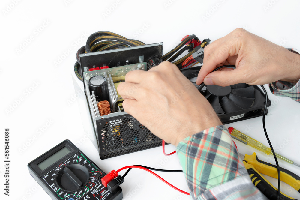 repair of a disassembled Computer Power Supply Unit, tester measurement ...