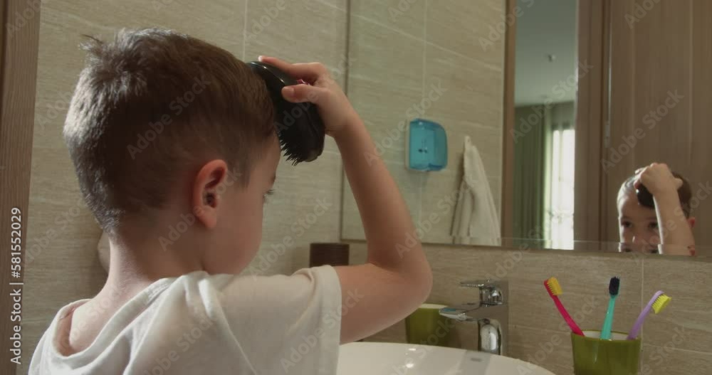 Stockvideo Daily hygiene and child care. Portrait of a six year old ...