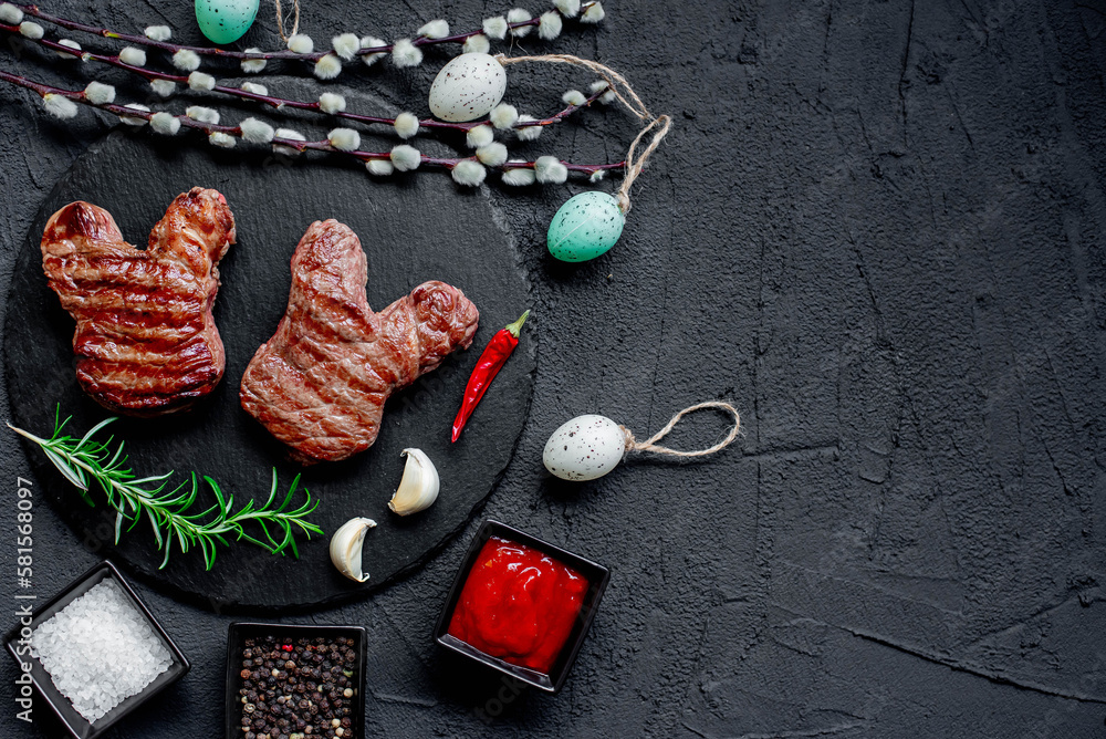Easter grilled beef steaks in the shape of a rabbit on a stone ...