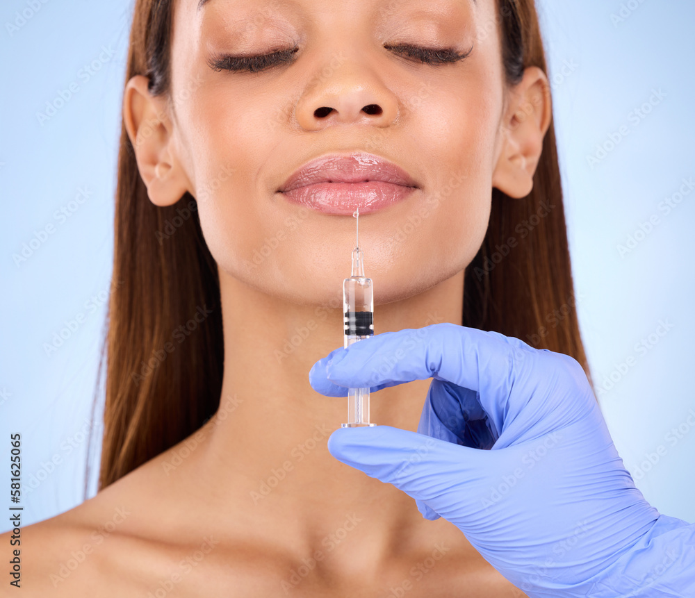 Face, lips and injection of woman on studio, blue background and facial ...