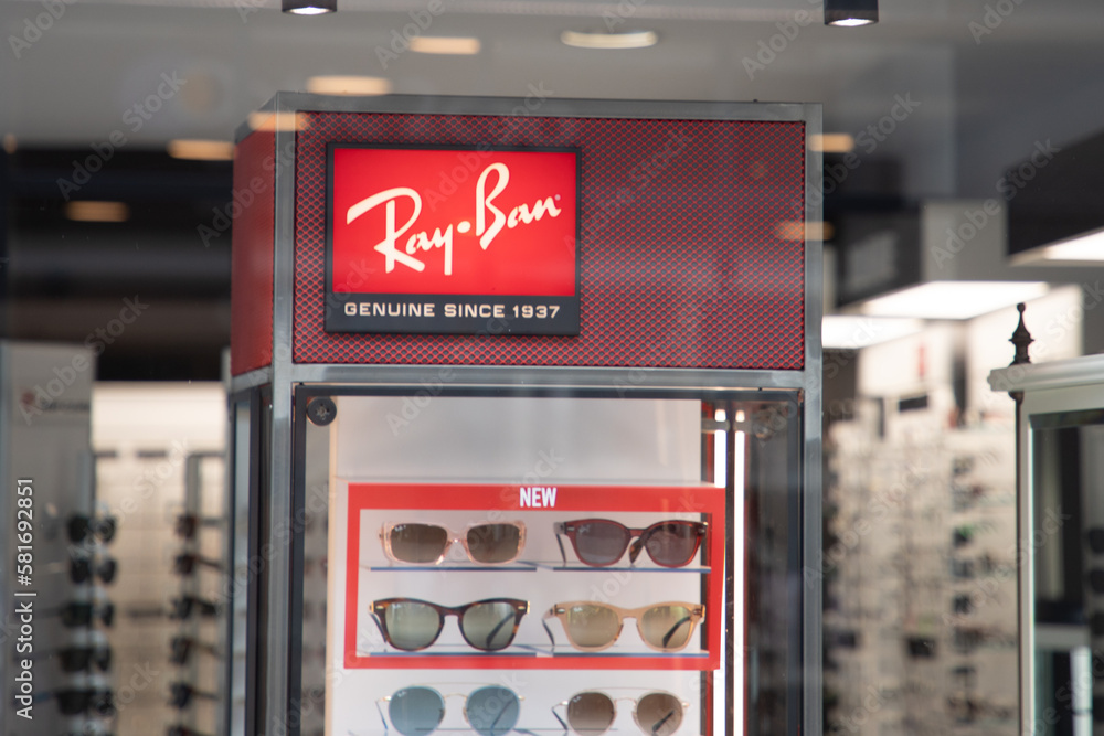 ray-ban genuine sign brand and text logo display store of sunglasses ...