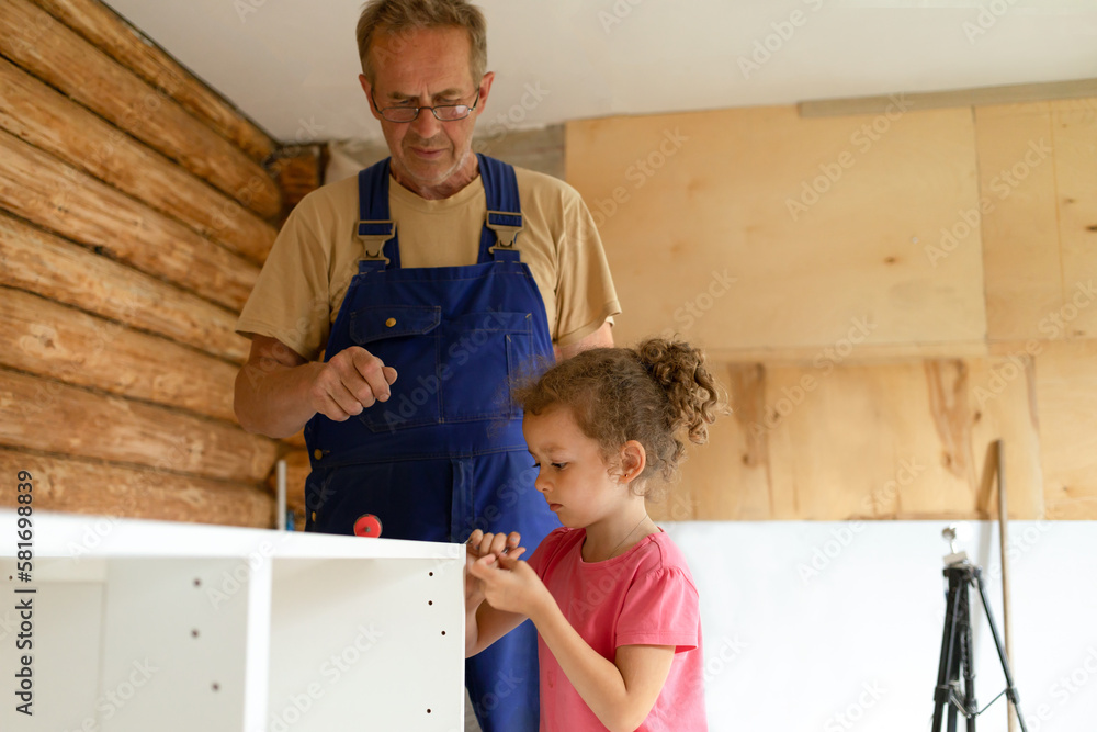 child helping father dad, grandfather building, working with wooden ...