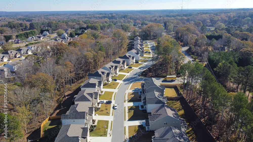 Lush tree residential neighborhood with broadcast tower background in ...