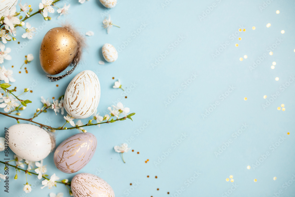 beautiful light easter layout with gold and marble eggs, cherry ...