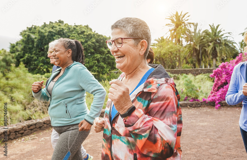 Fit senior people running at city park - Group of elderly friends doing ...