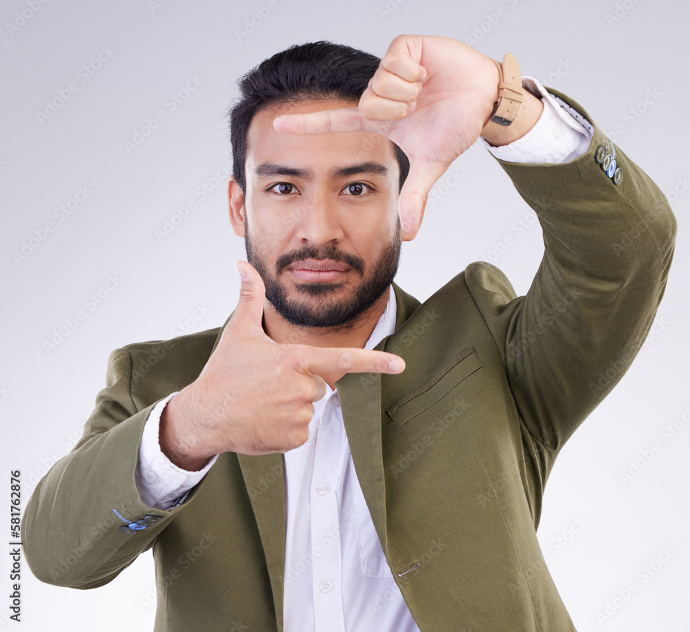 Finger framing, portrait and business man in studio, background or ...