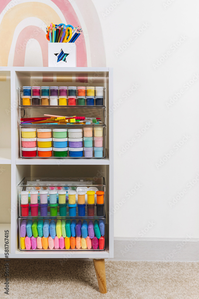 Transparent plastic containers with stationery and supplies for drawing ...